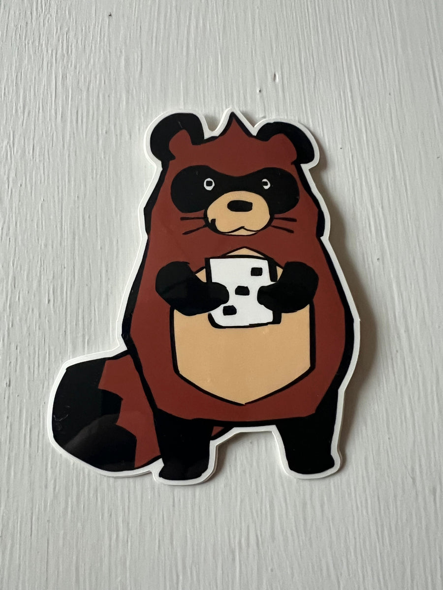 Tanuki Merch - Tanuki Holding Dice Sticker – Tanuki Games